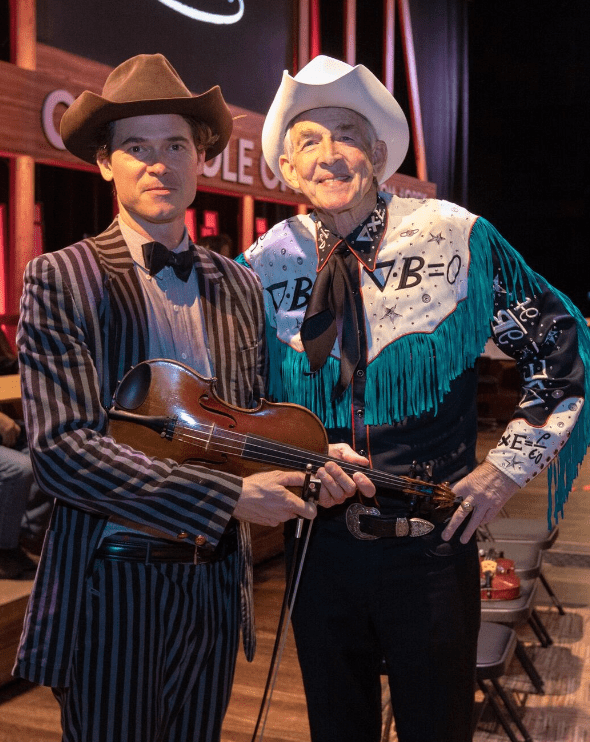 Ketch Secor Receives Treasured Acuff Fiddle From Woody Paul During Opry ...