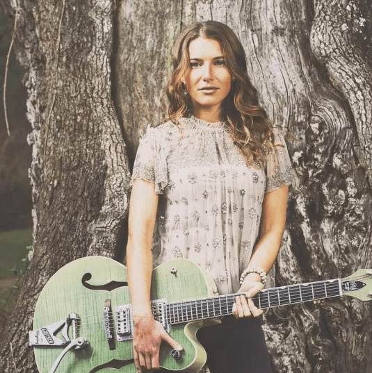 Caroline Jones Talks Opening For Vince Gill And Kenny Chesney, Keeping ...